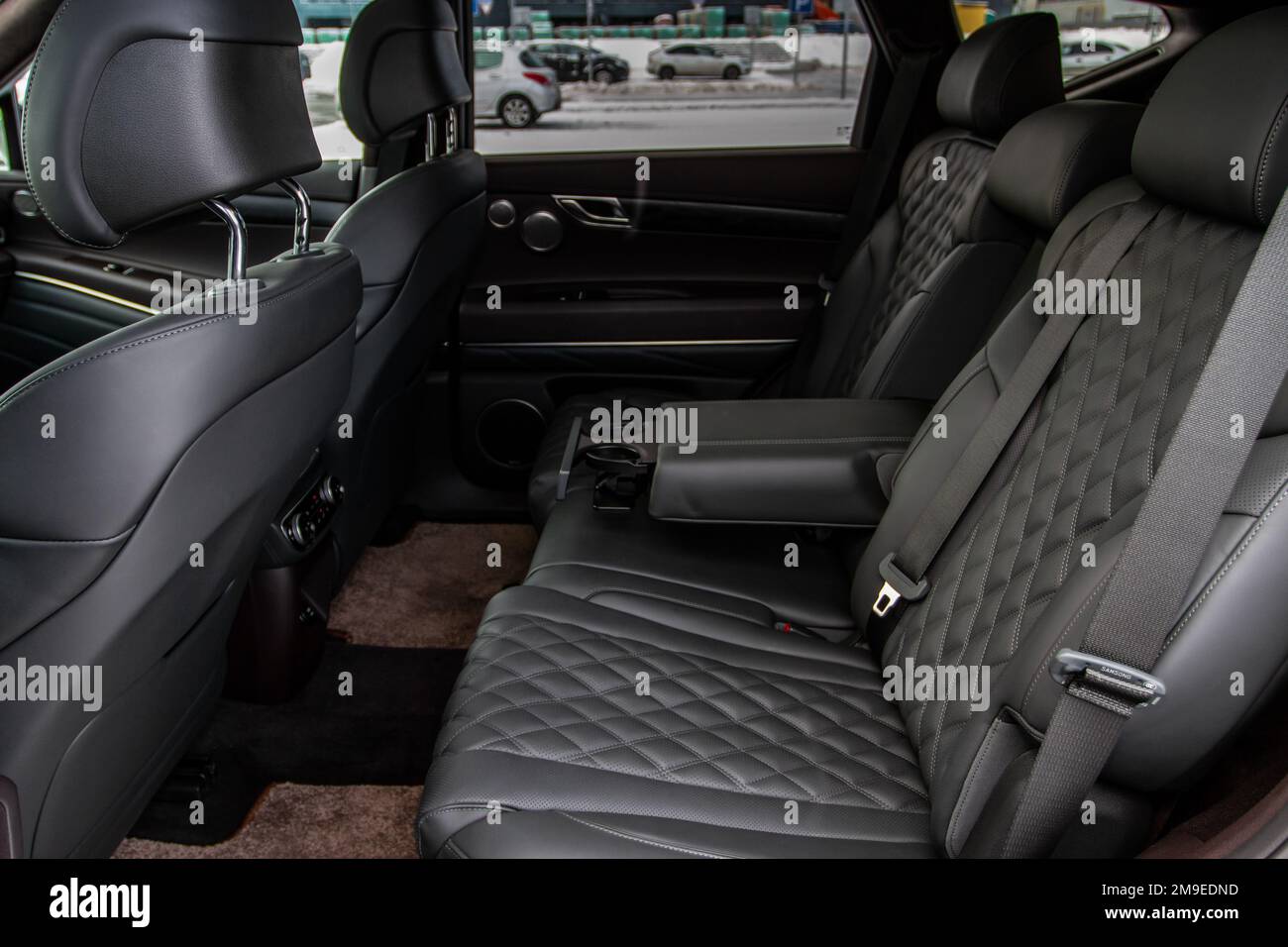 Modern car interior. Clean rear seats with the belts. Three rear seats ...