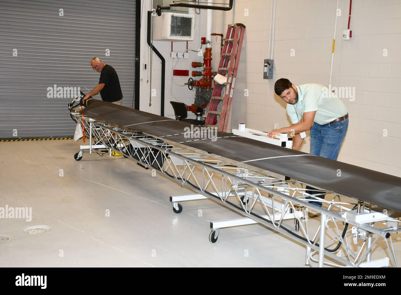 Robert Call, left, work leader for the Fleet Readiness Center East ...