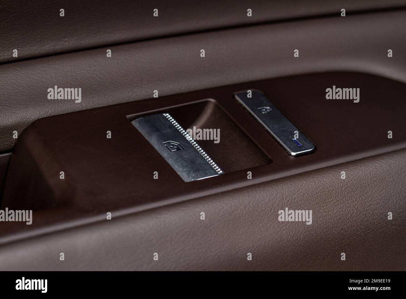 Interior doors of the car. Car door panel with buttons for lock car and ...