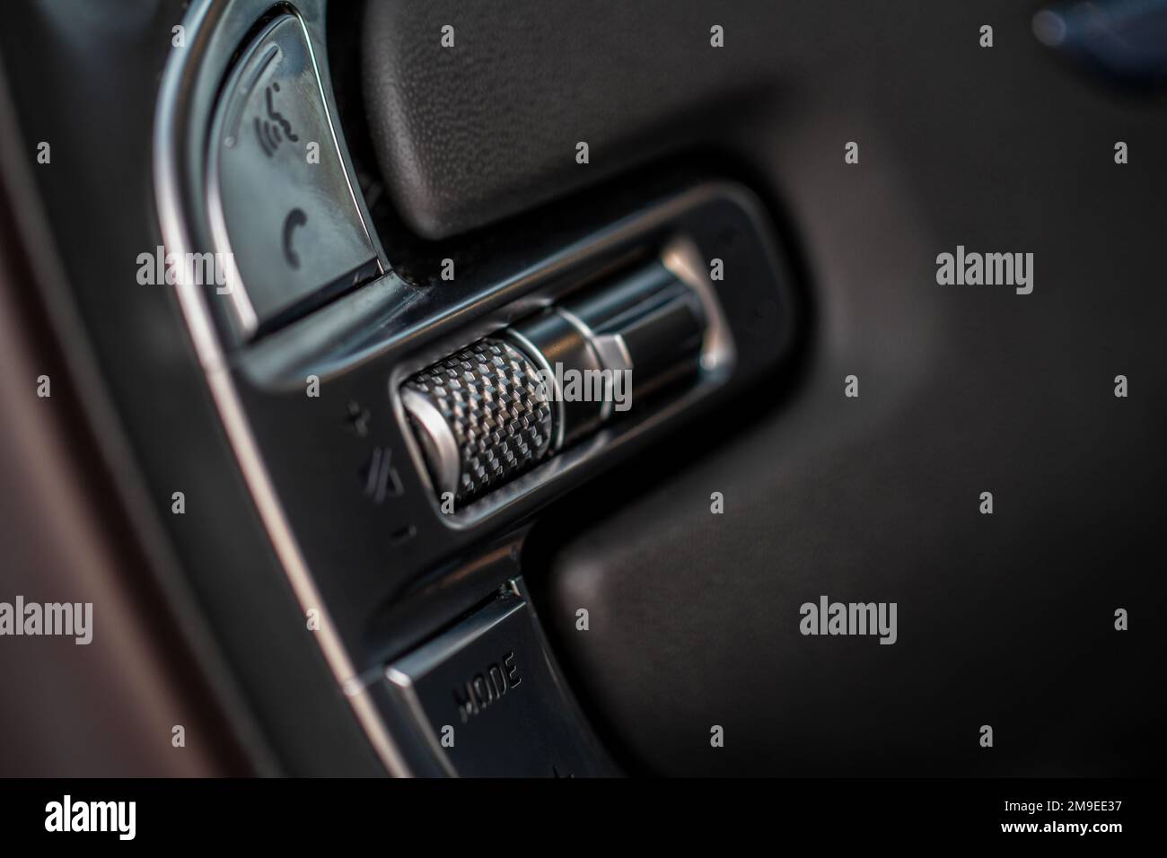 Volume and audio control buttons on the steering wheel. Car audio ...