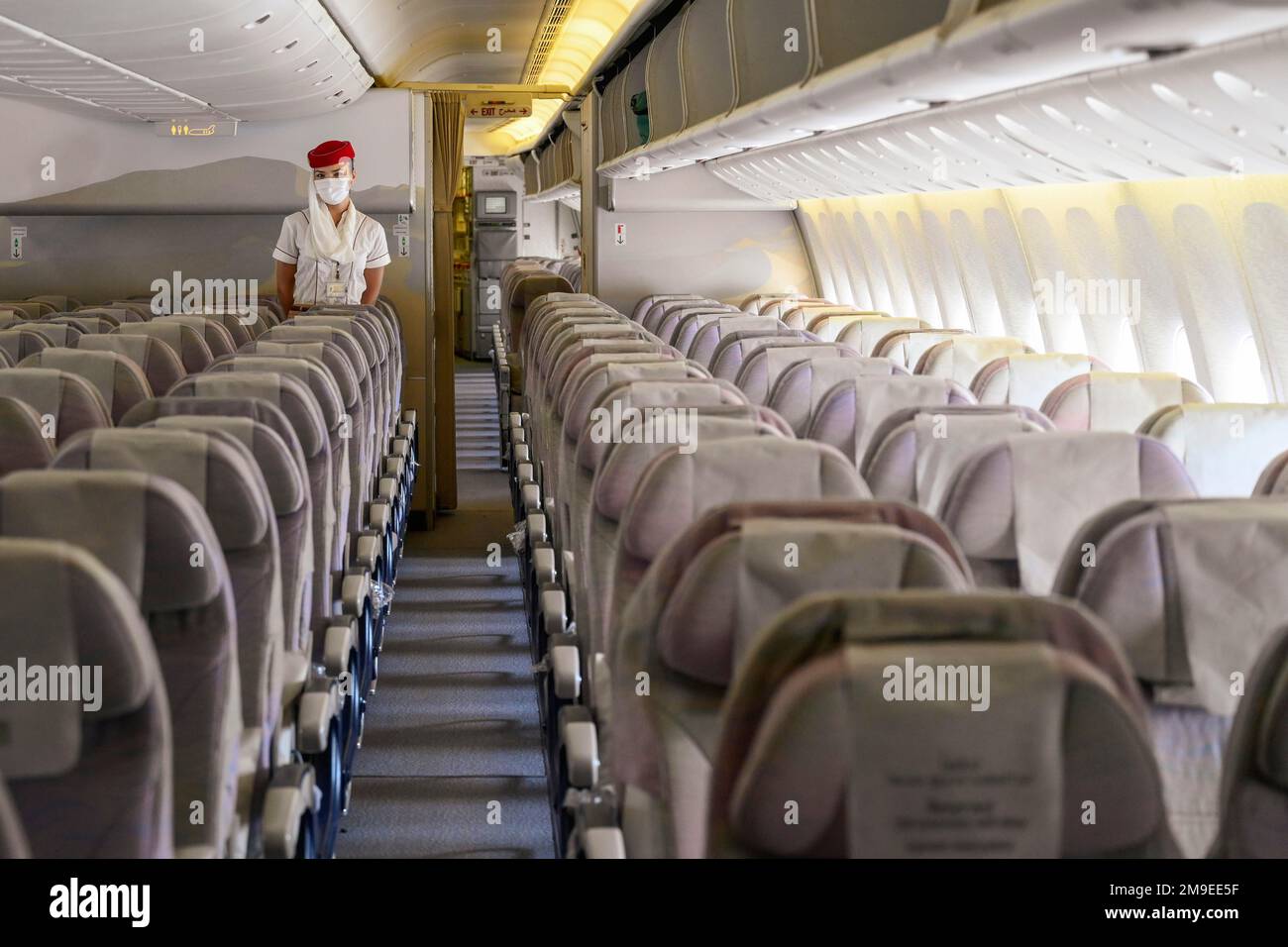 Flight attendant Emirates, Boeing 777-300, Dubai, UAE Stock Photo - Alamy