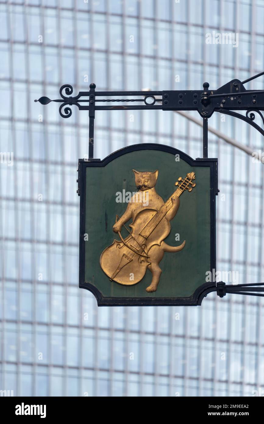 Cat playing double bass, golden nose sign, financial district City of ...