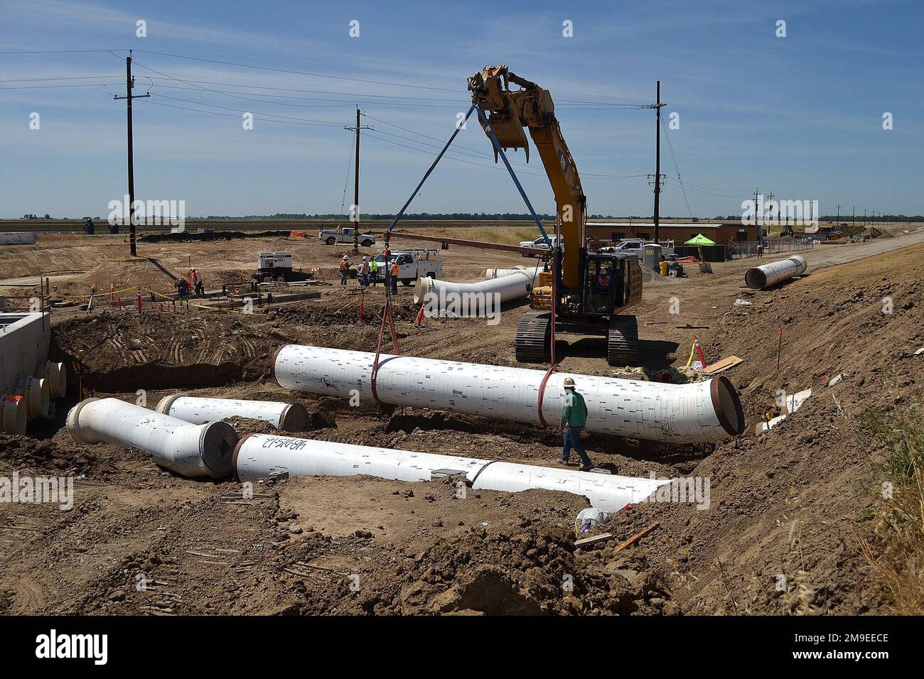 A final series of conveyance pipes are set in place, ready to be ...