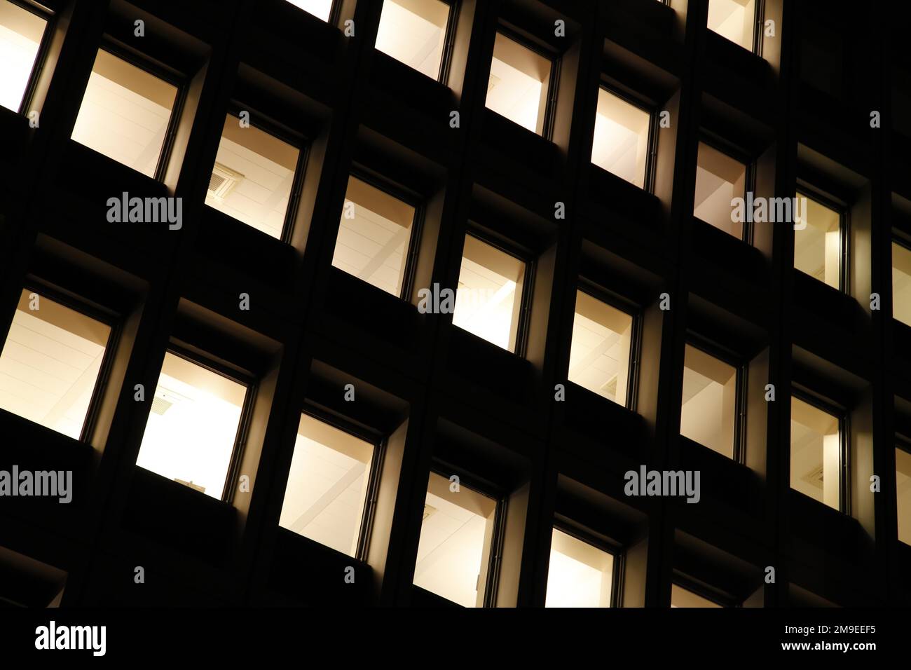 Windows at night, office building Stock Photo - Alamy