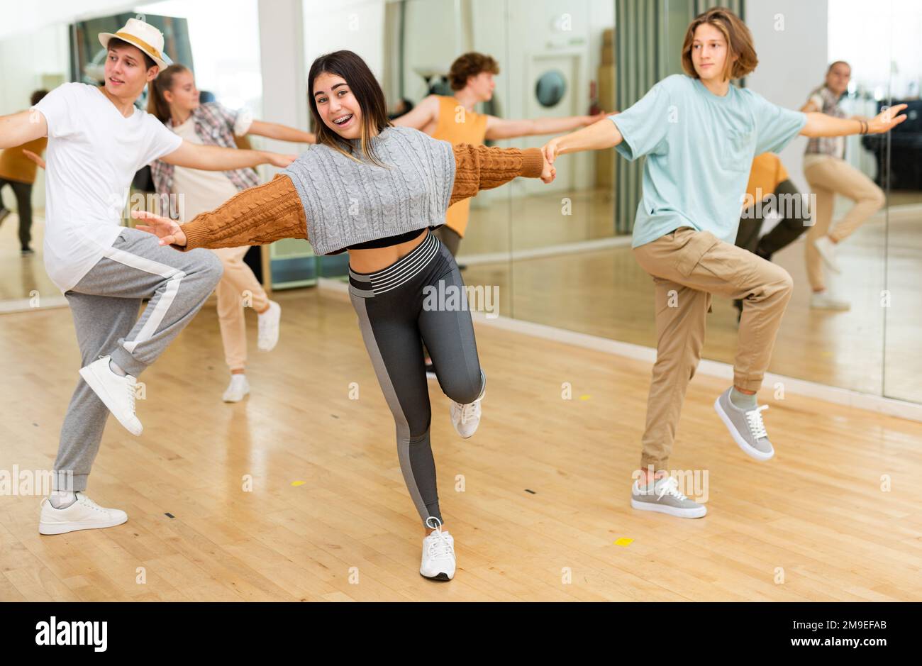 Youth boys and girls dancing jive in studio Stock Photo - Alamy