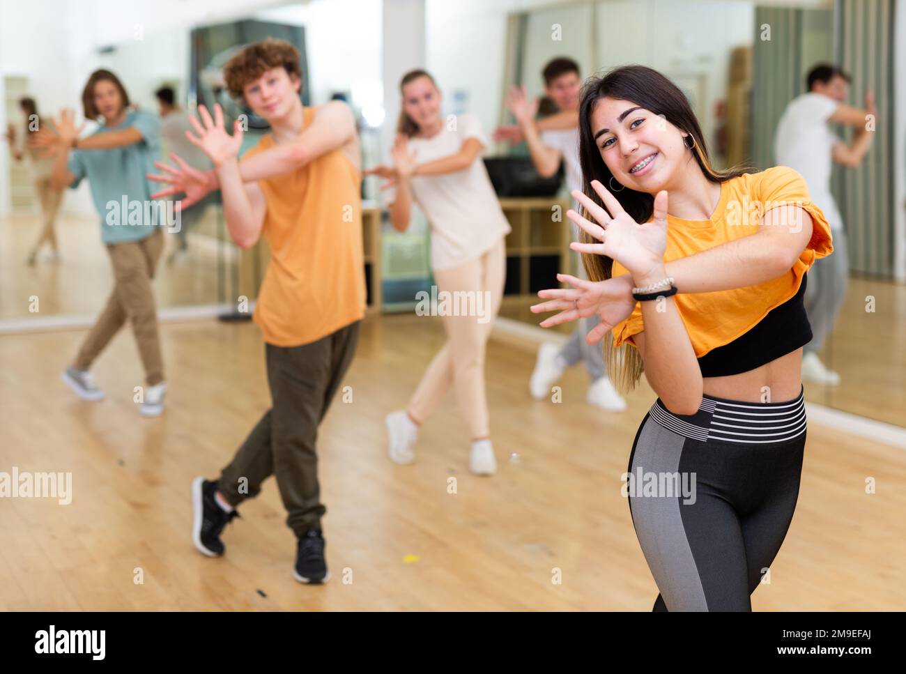 Teens performing modern dance in studio Stock Photo - Alamy