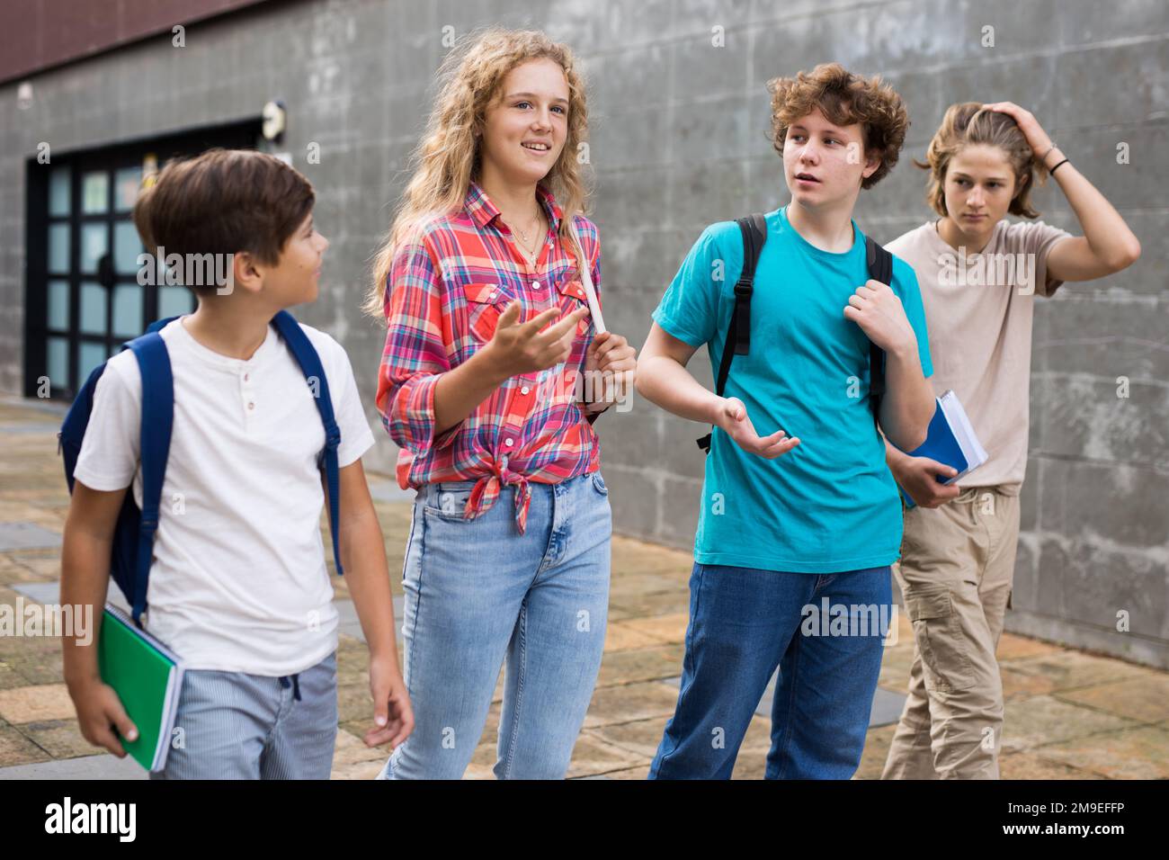 School friends walk after class Stock Photo - Alamy