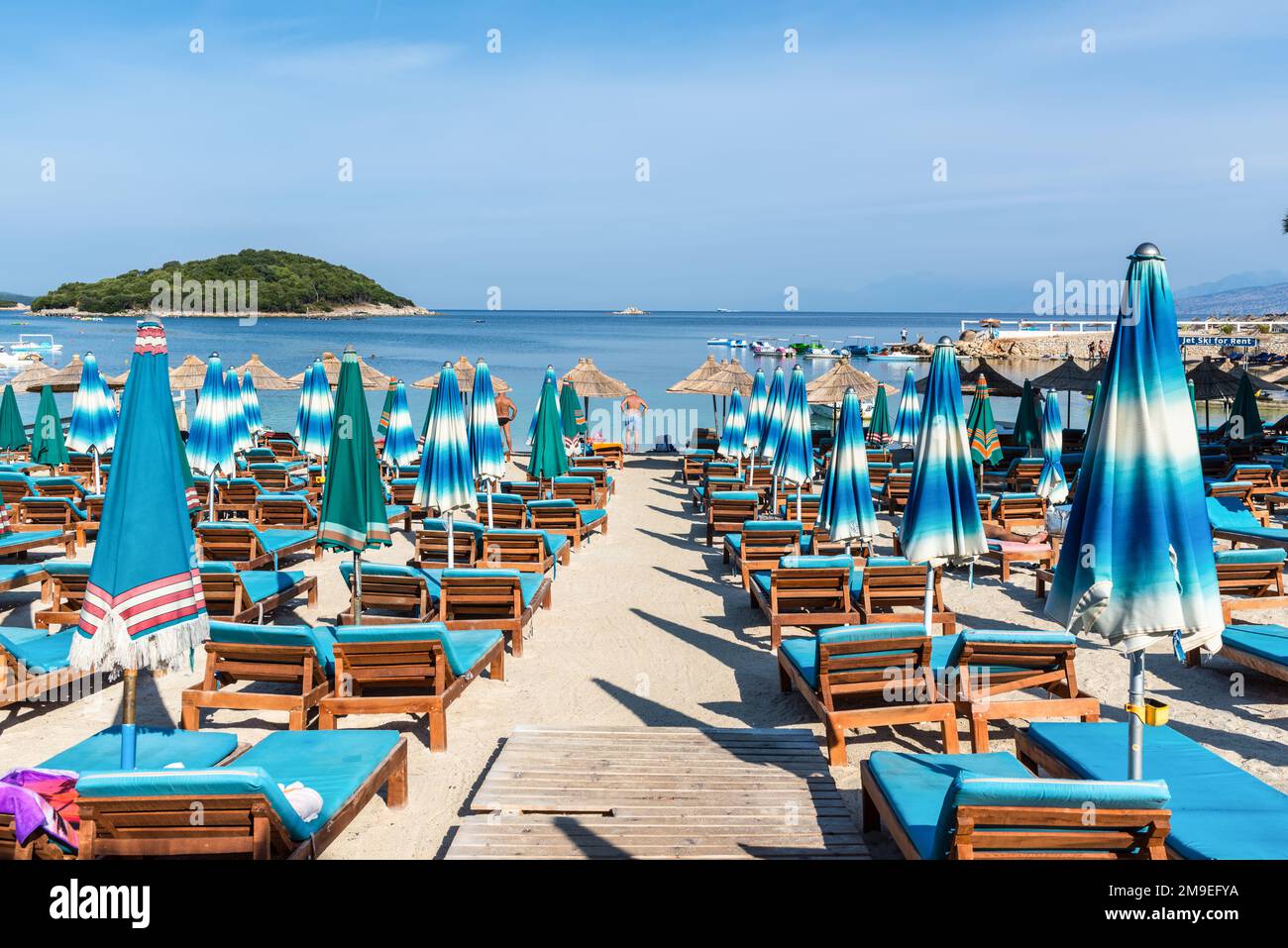 Ksamil, Albania - September 11, 2021: Few people relaxing on the Poda ...