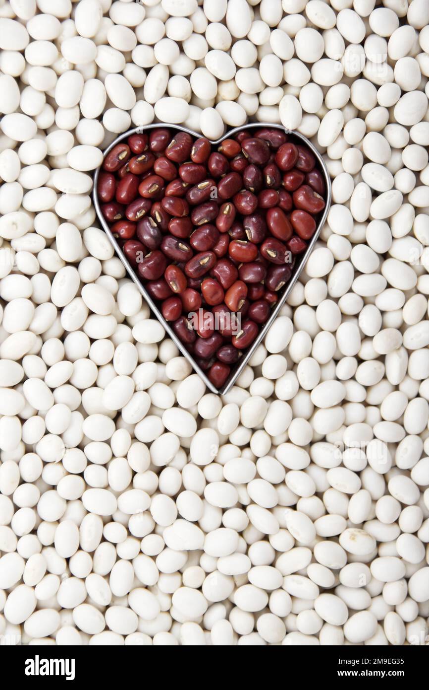 Red beans in heart shape among white beans Stock Photo - Alamy