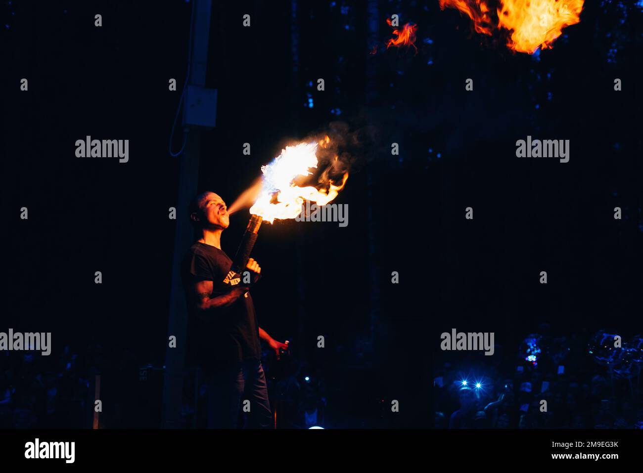 VICHUGA, RUSSIA - JUNE 17, 2018: Fire show, fakir man makes the night ...