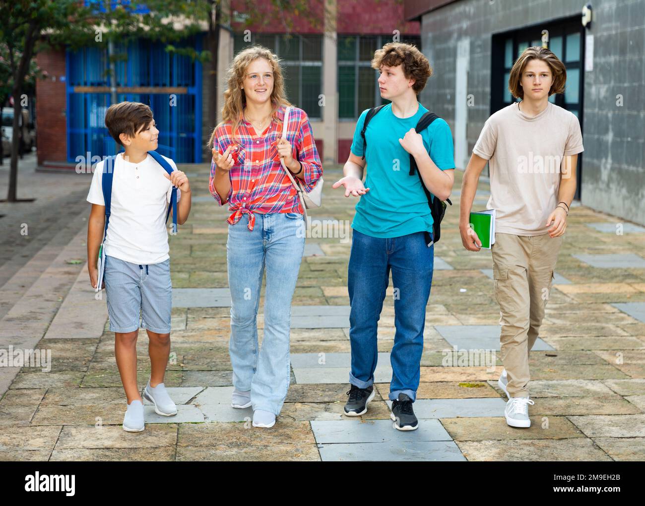 School friends walk after class Stock Photo - Alamy
