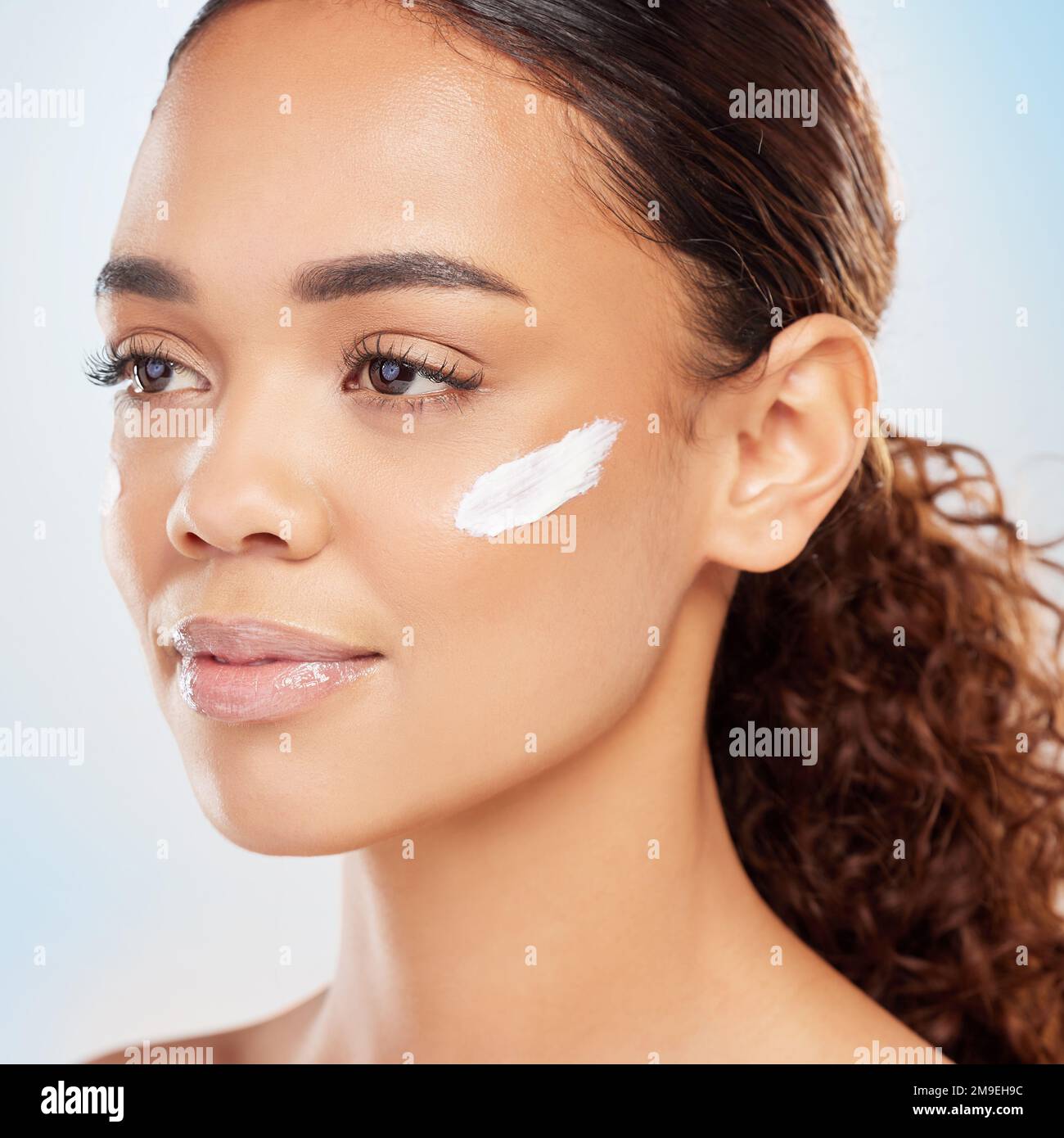 Applying sunscreen serious hi-res stock photography and images - Alamy