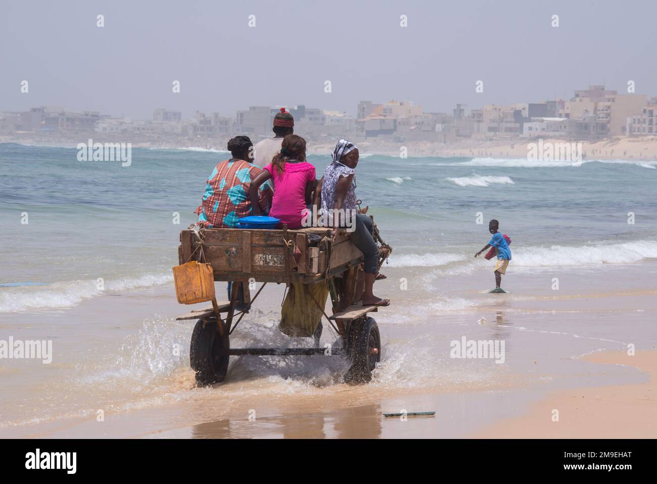 Family on a horse cart circulating on the beaches of the popular ...