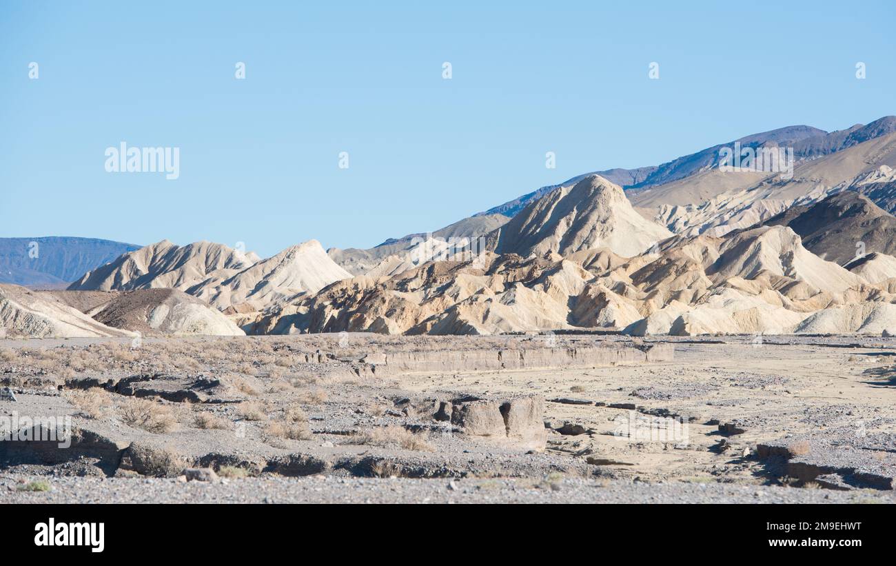 A scene of the semi-desert zone with rocky mountains and sandy ground ...