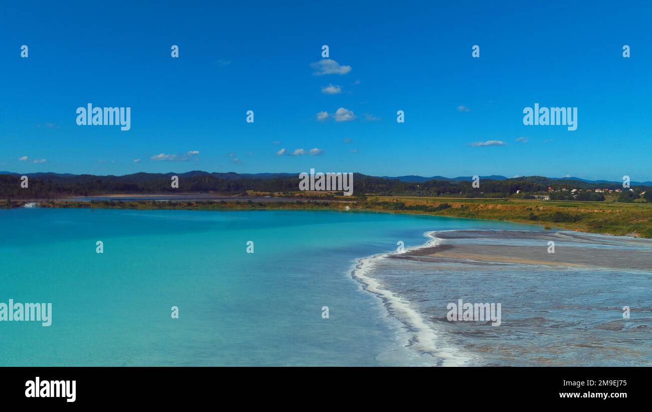 Top down aerial view over natural texture - abstract industrial lake ...