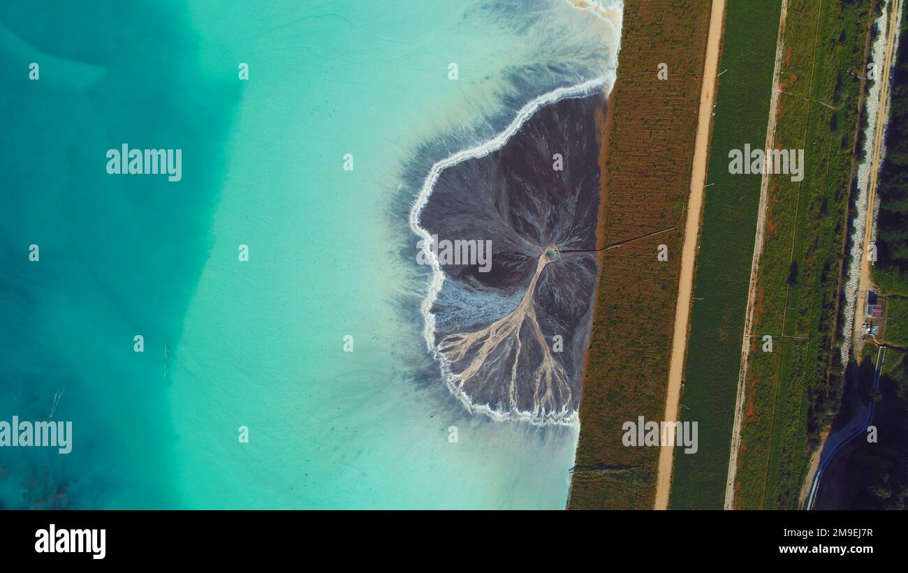 Top down aerial view over natural texture - abstract industrial lake ...