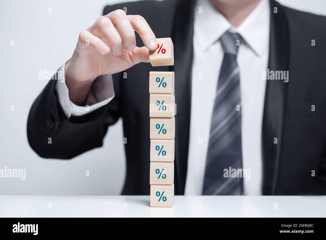Wooden blocks with green percent signs, pyramid, business percentage ...