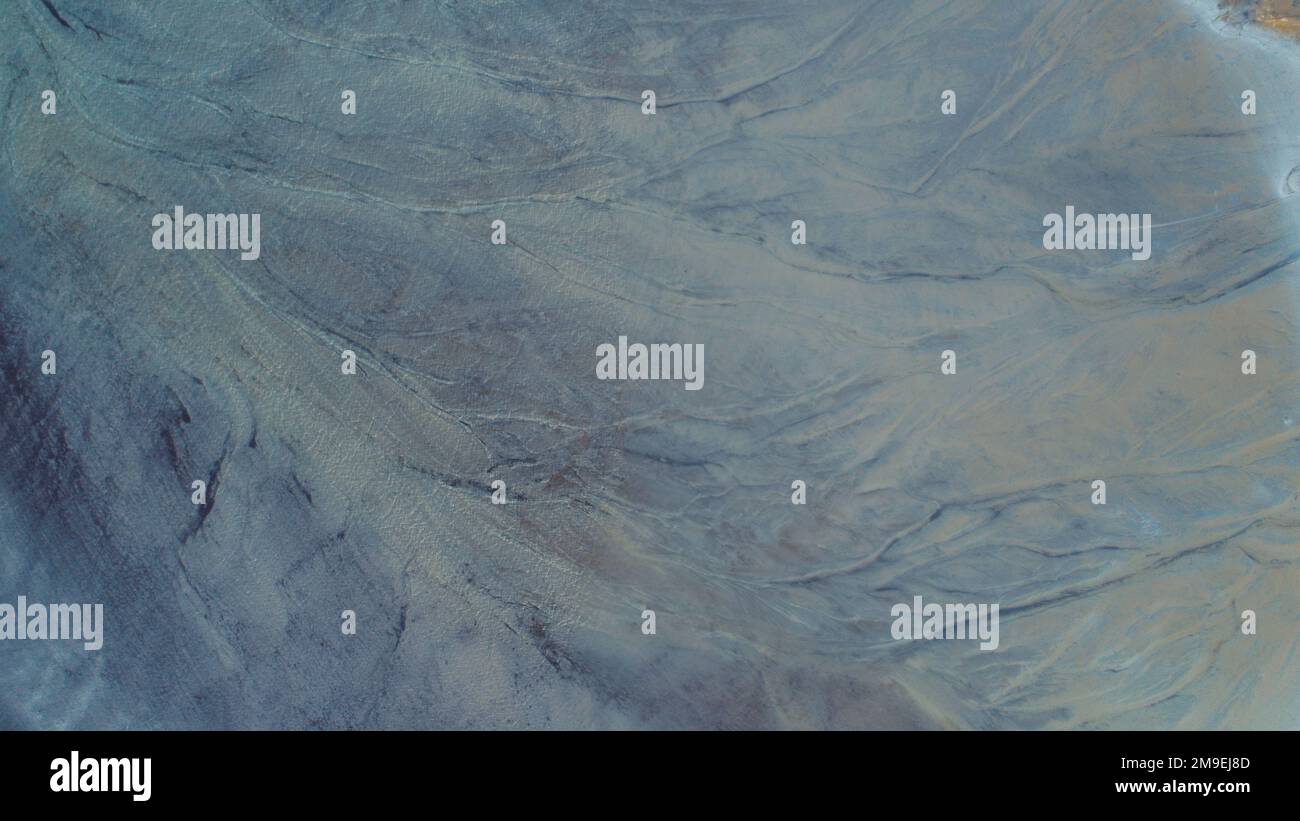 Top down aerial view over natural texture - abstract industrial lake ...