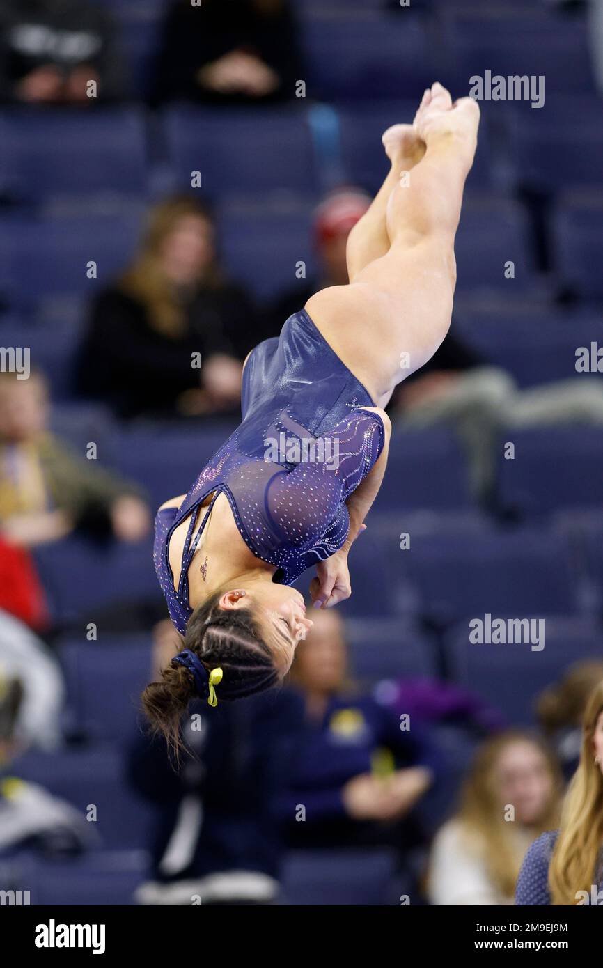 Michigan's Nicoletta Koulos competes in the beam during an NCAA ...