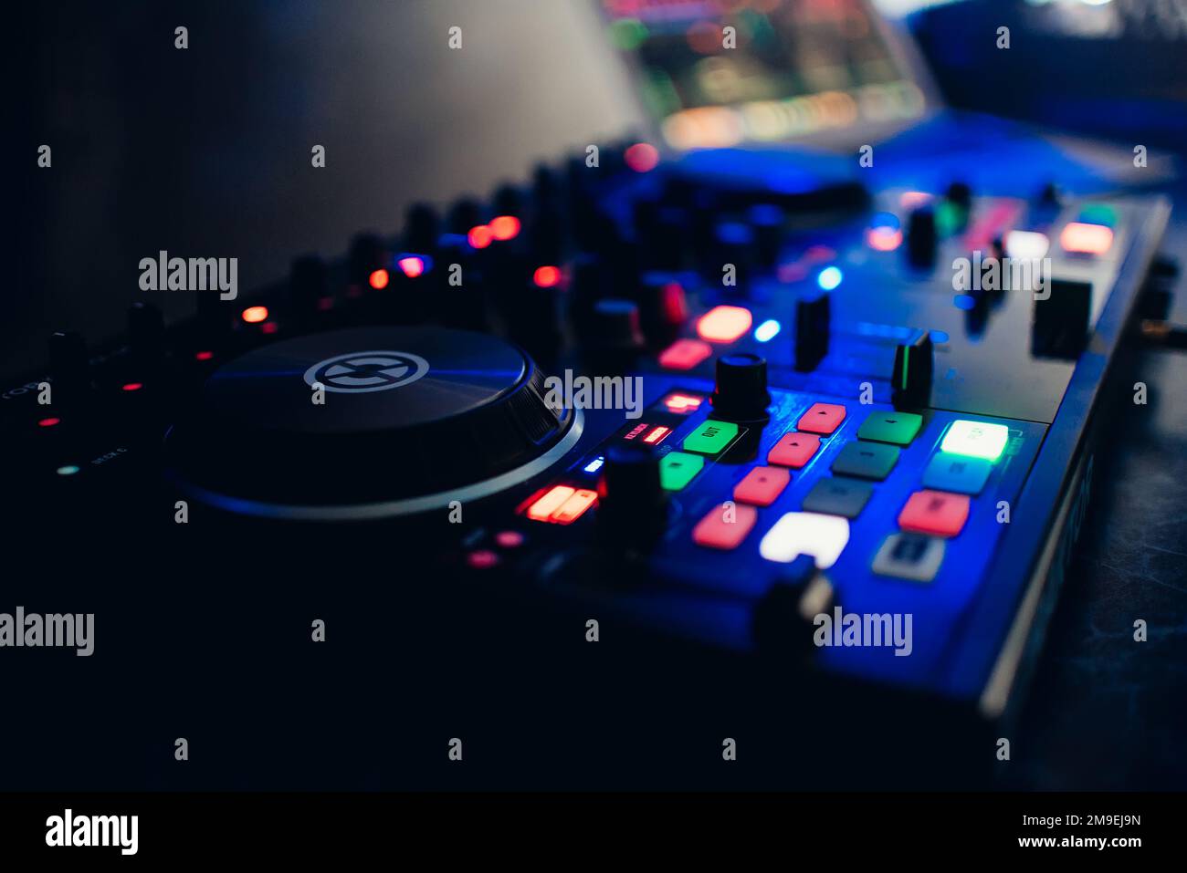 DJ mixer controller panel for playing music and partying in a nightclub ...