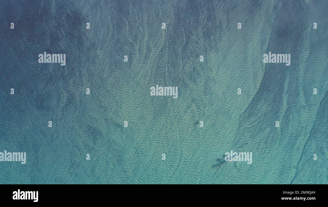 Top down aerial view over natural texture - abstract industrial lake ...