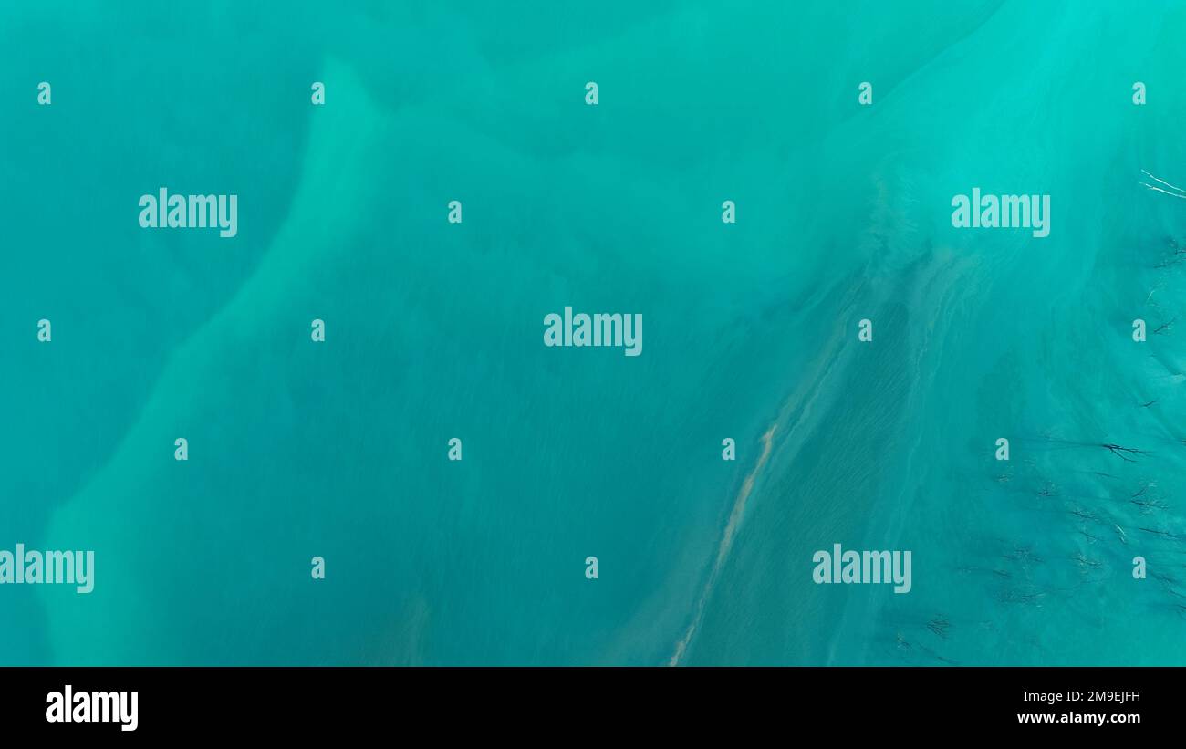 Top down aerial view over natural texture - abstract industrial lake ...