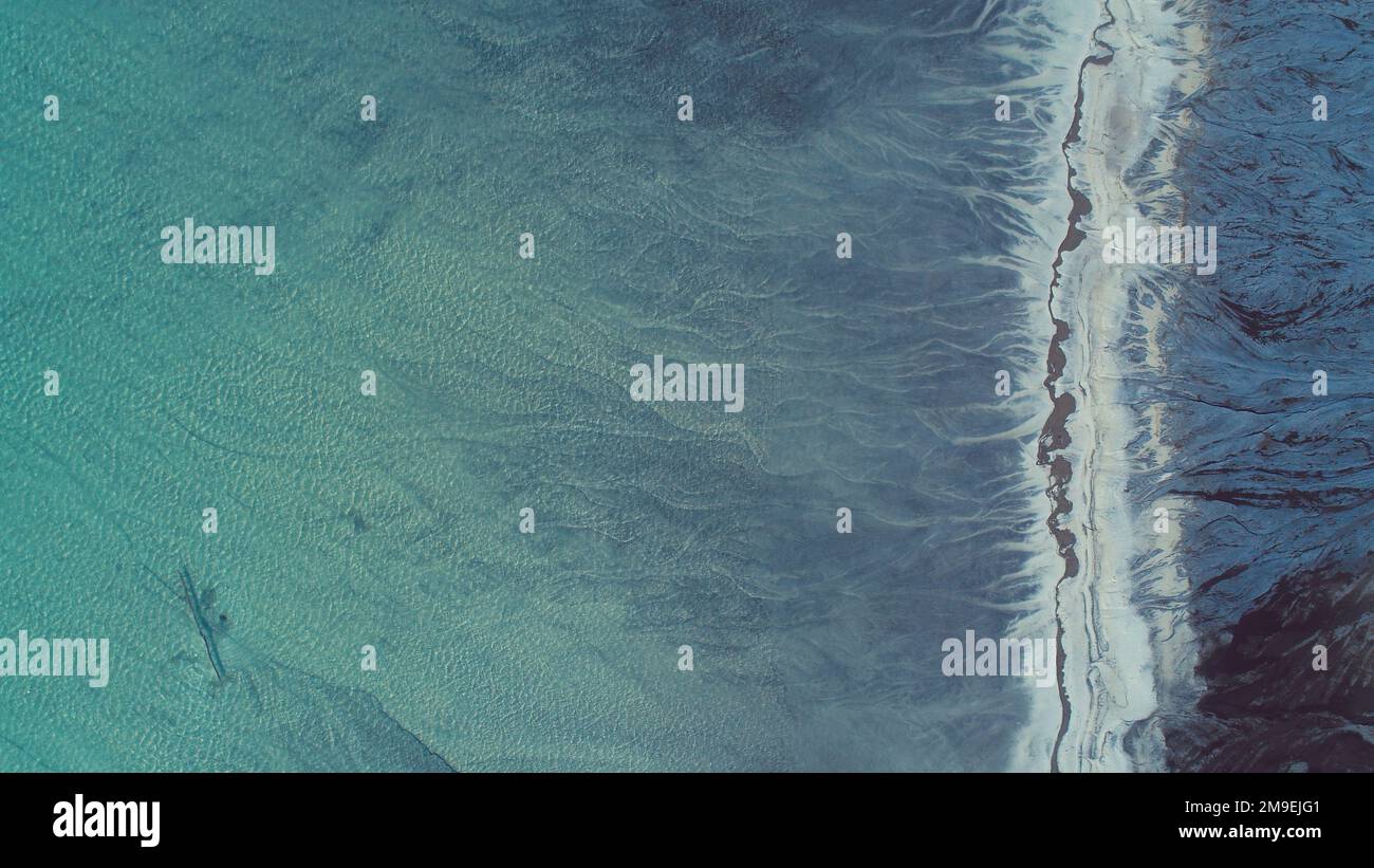 Top down aerial view over natural texture - abstract industrial lake ...