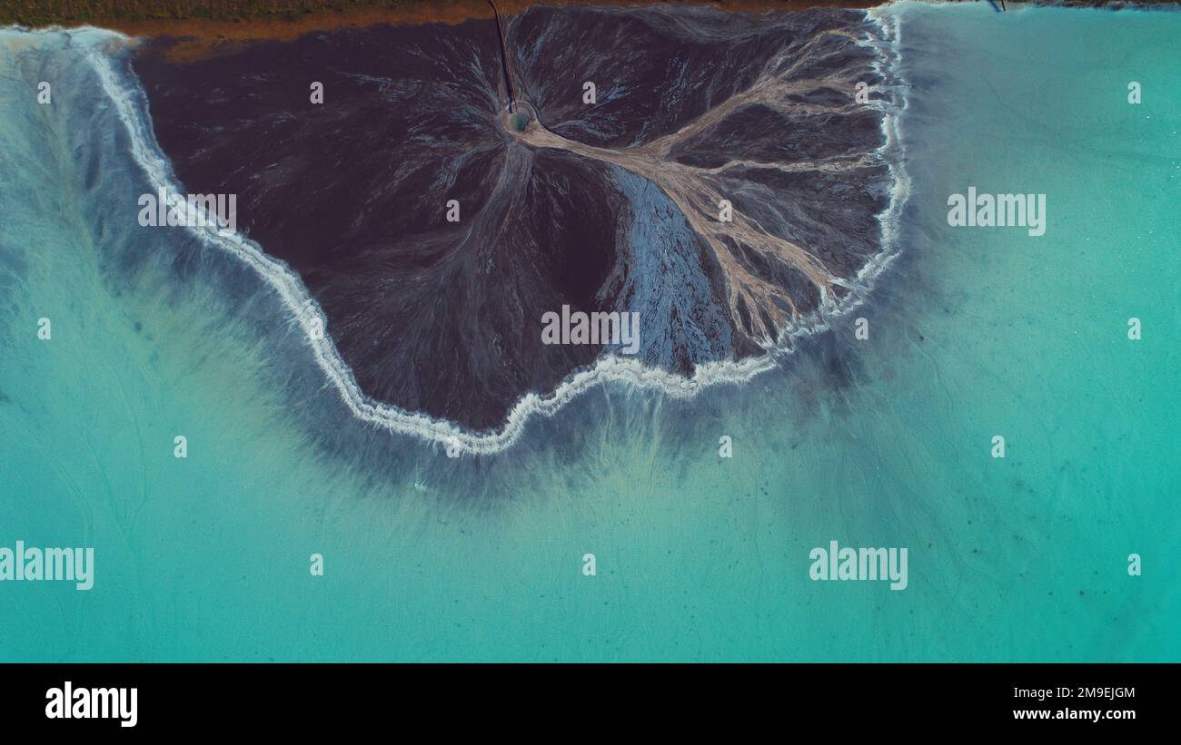 Top down aerial view over natural texture - abstract industrial lake ...