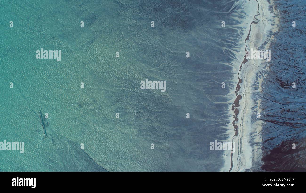 Top down aerial view over natural texture - abstract industrial lake ...