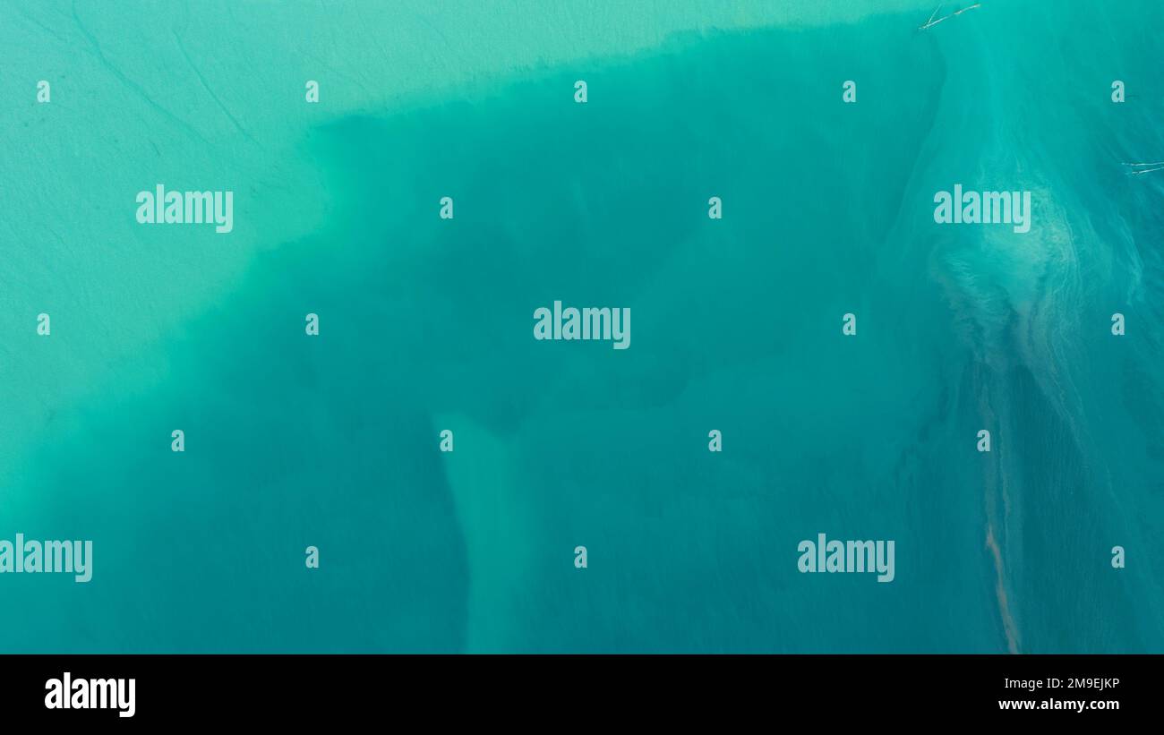 Top down aerial view over natural texture - abstract industrial lake ...