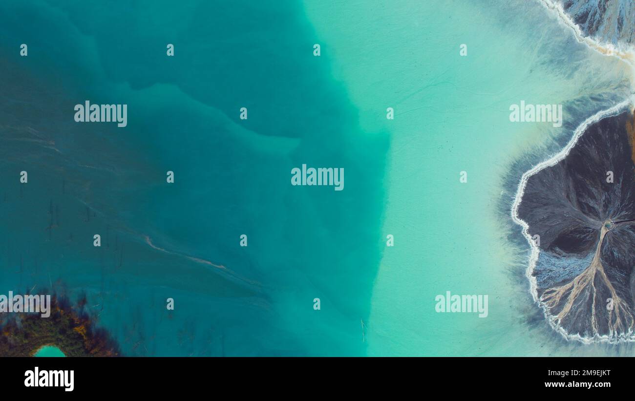 Top down aerial view over natural texture - abstract industrial lake ...