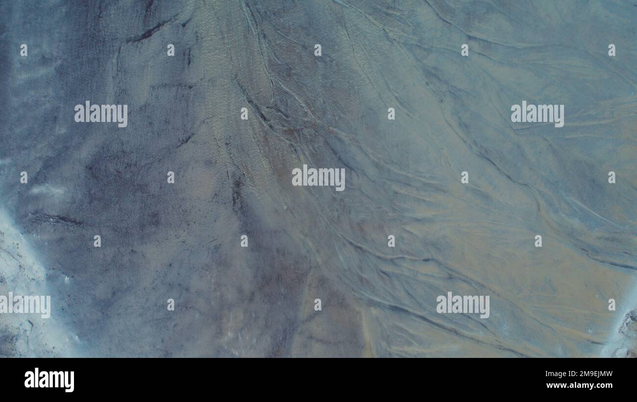 Top down aerial view over natural texture - abstract industrial lake ...