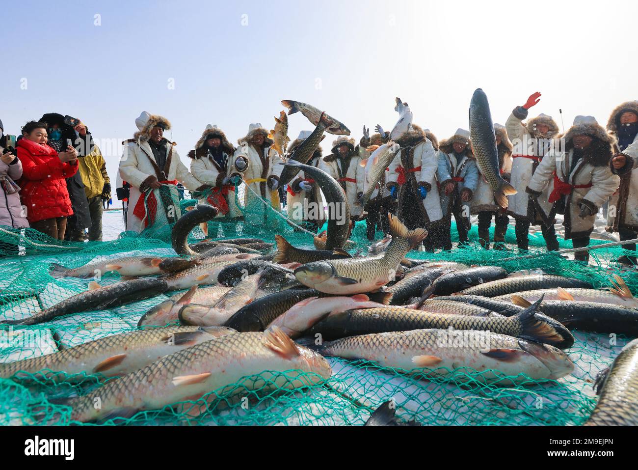 Fishermen catch fish at the frozen Bosten Lake in Bohu County ...