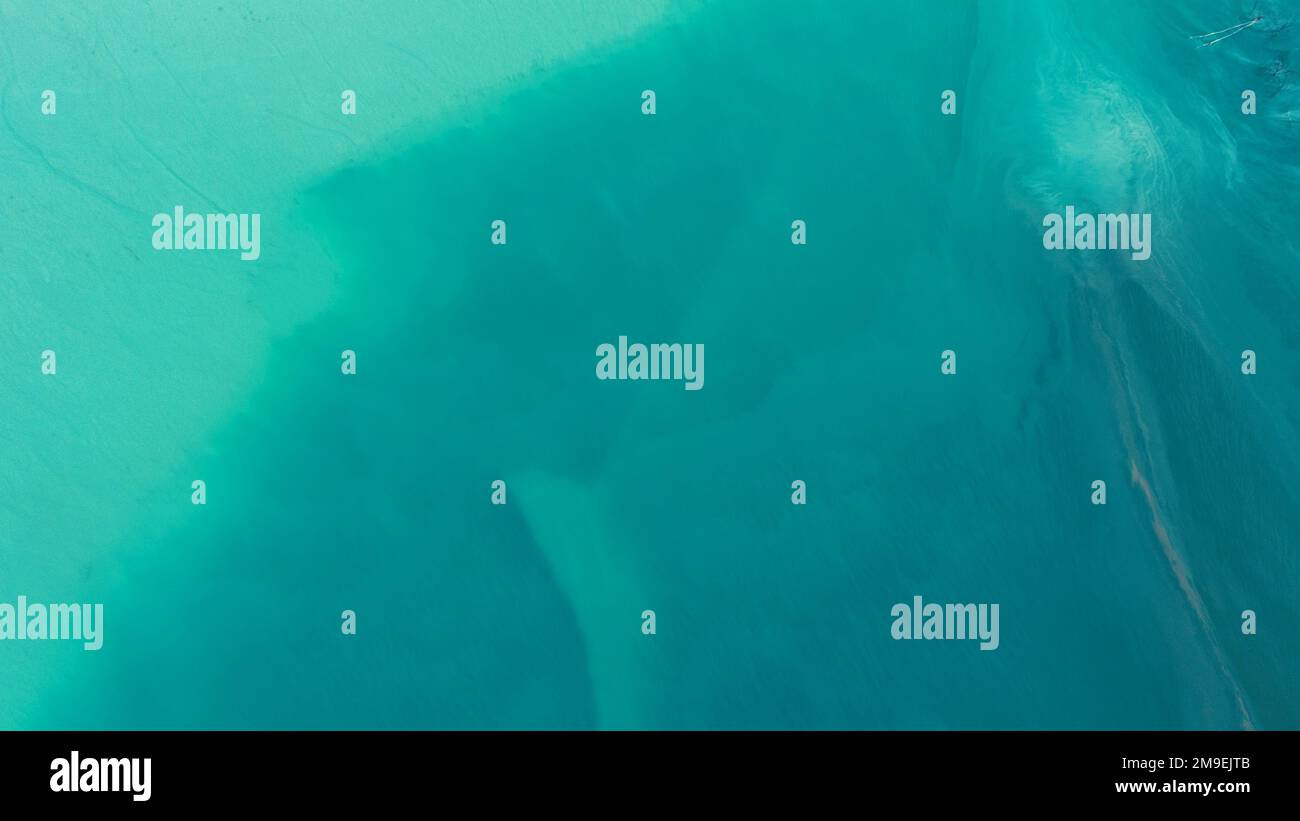 Top down aerial view over natural texture - abstract industrial lake ...