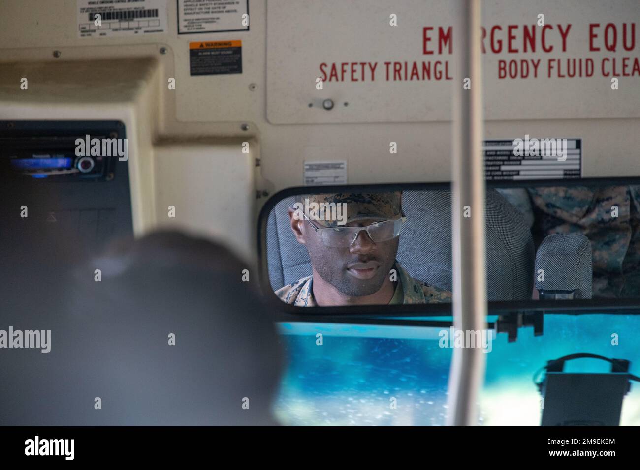 A U.S. Marine drives the shuttle bus with the Security Augmentation ...