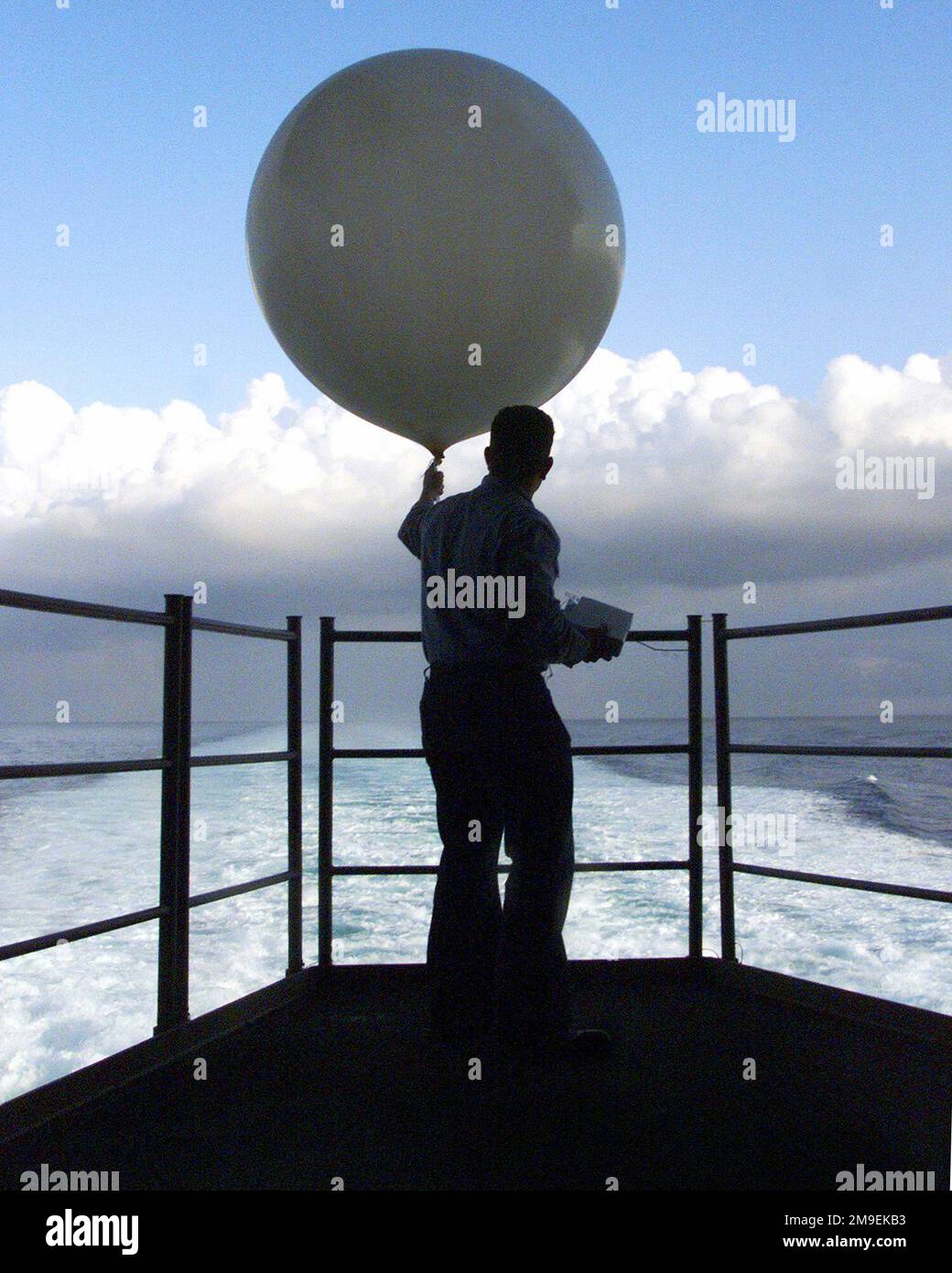 US Navy Aerographers Mate Third Class Robert Mason releases a weather ...
