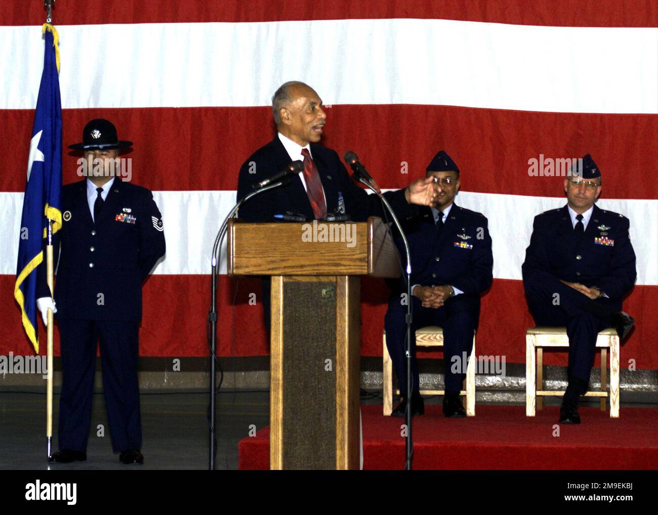 Medium shot, front view, at lectern, Dr. Roscoe C. Brown, Director ...
