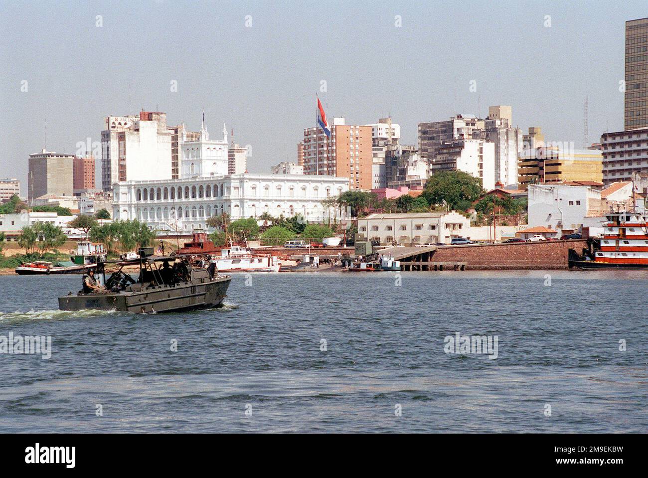 A Riverine Assault Craft travels down the Rio Parana with Asuncion ...