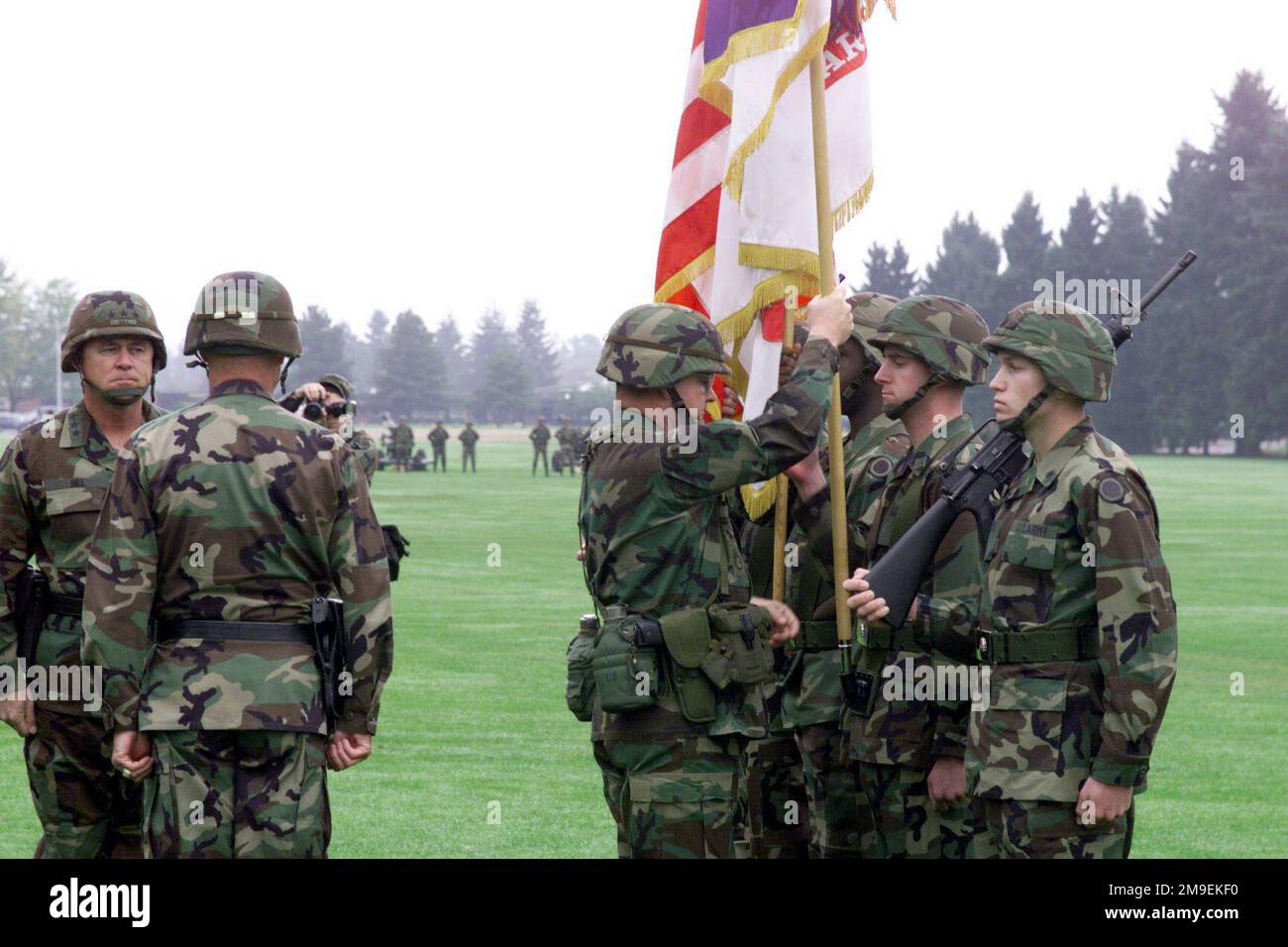 Command Sergeant Major Johnny J. Austin secures the colors following ...