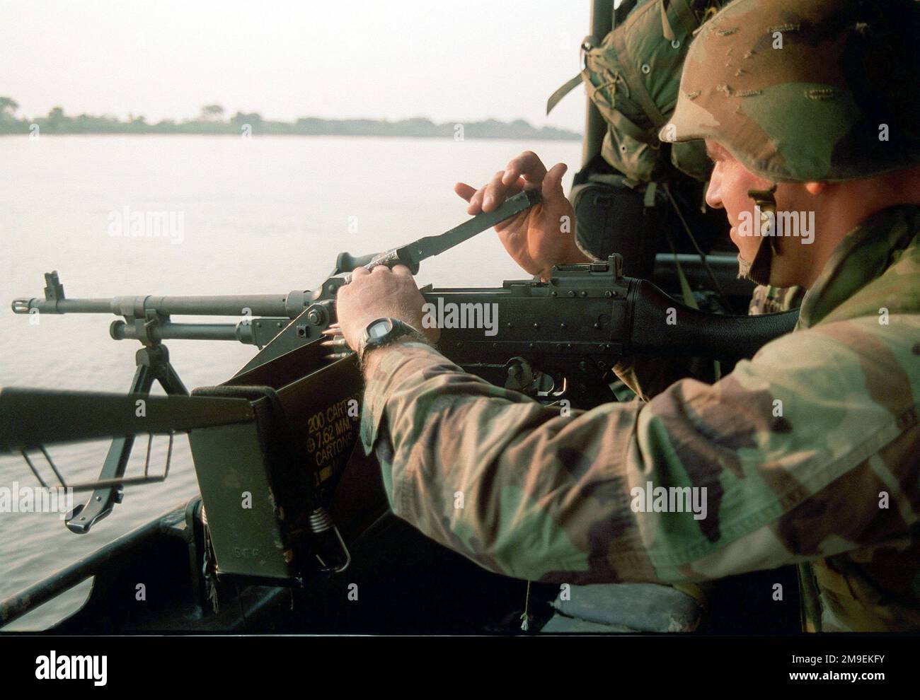 Lance Corporal Mike O'Connel from Unitas 40-99 U.S. Task Group, fires ...