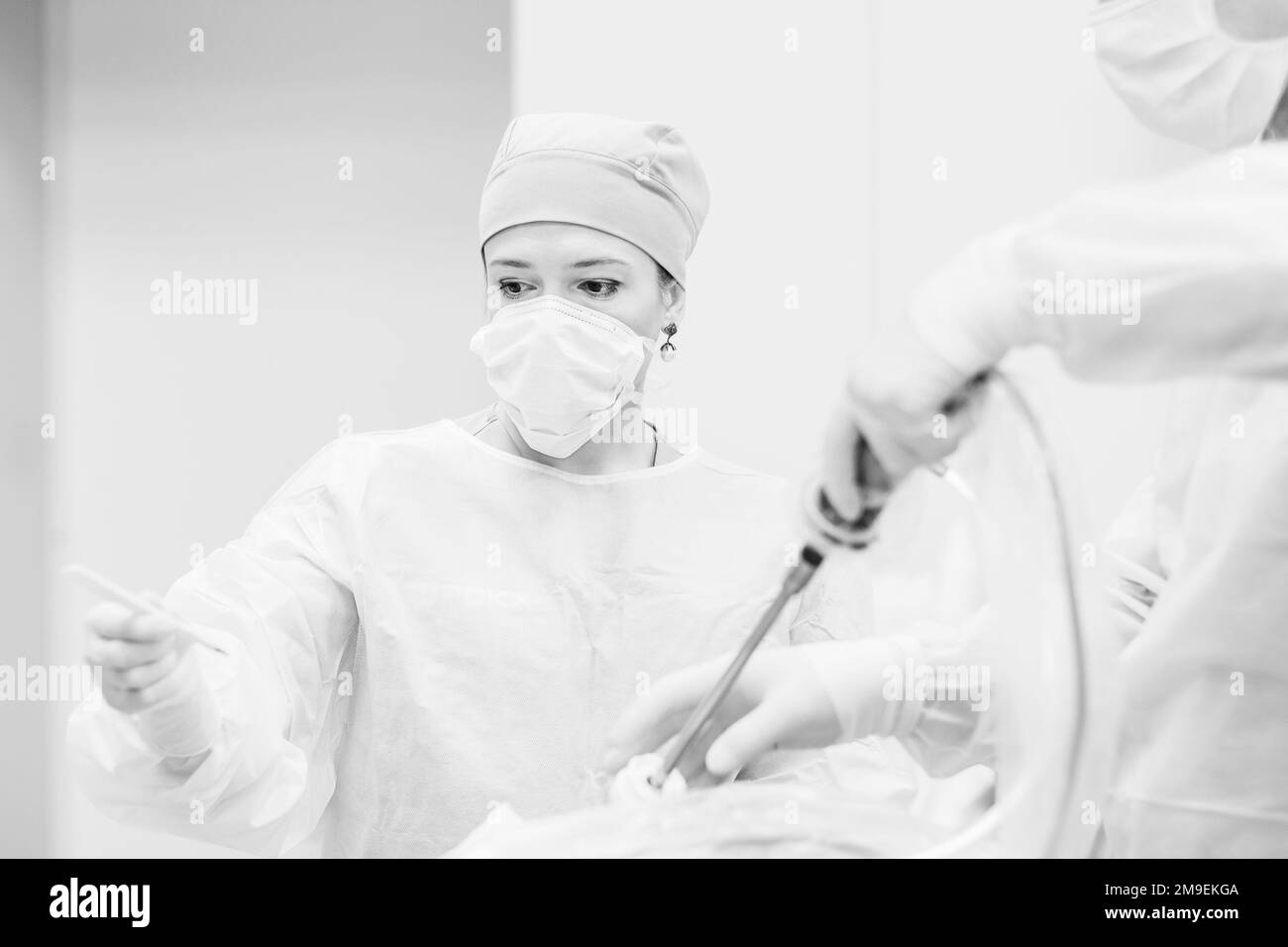 Black and white portrait of a female surgeon in the operating room ...