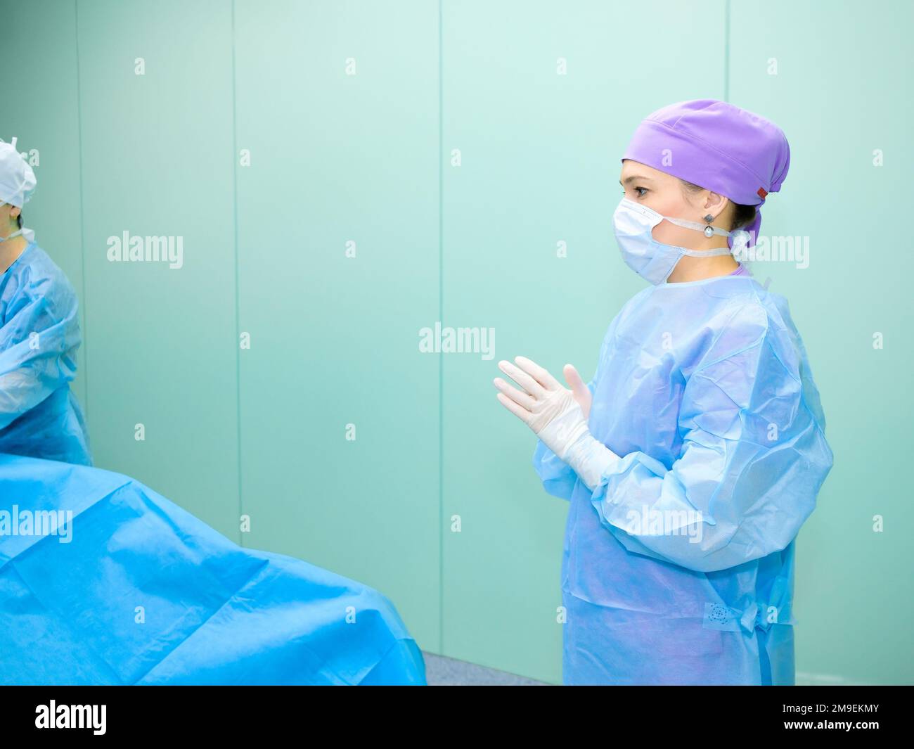 A Female Surgeon In Sterile Gloves And A Surgical Uniform In The