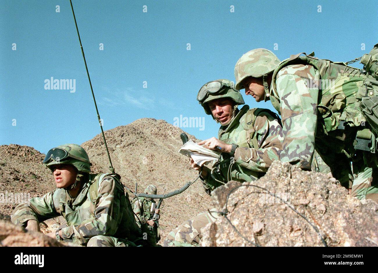 Marines from 3rd Tracks call for fire to suppress the enemy (not shown ...