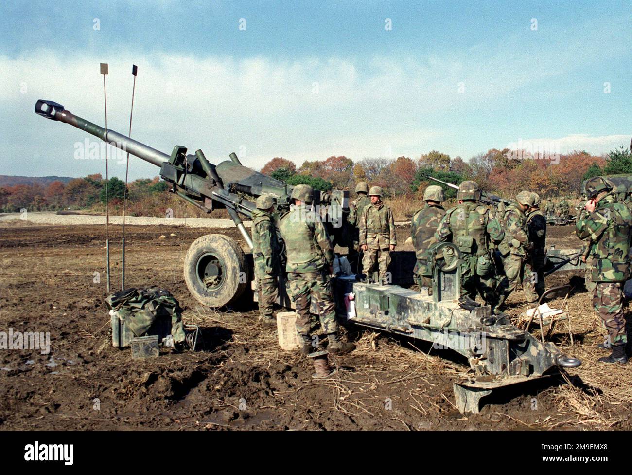 Left side profile medium shot of a US Marine M198,155mm Howitzer as US Marines from Lima Battery ...