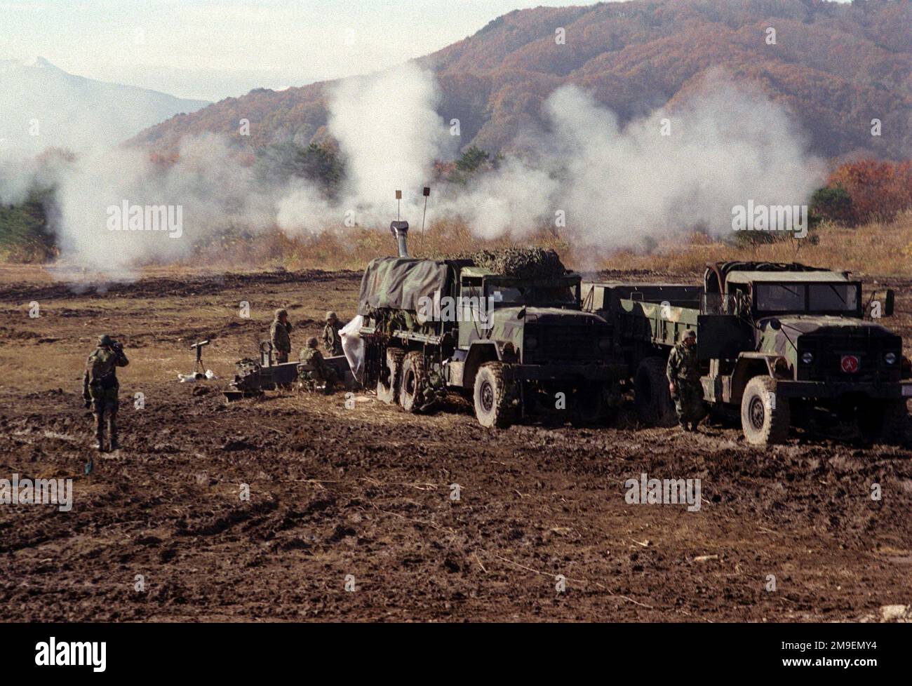 Right side front view long shot of two M923A1 (6X6) 5-ton cargo trucks ...