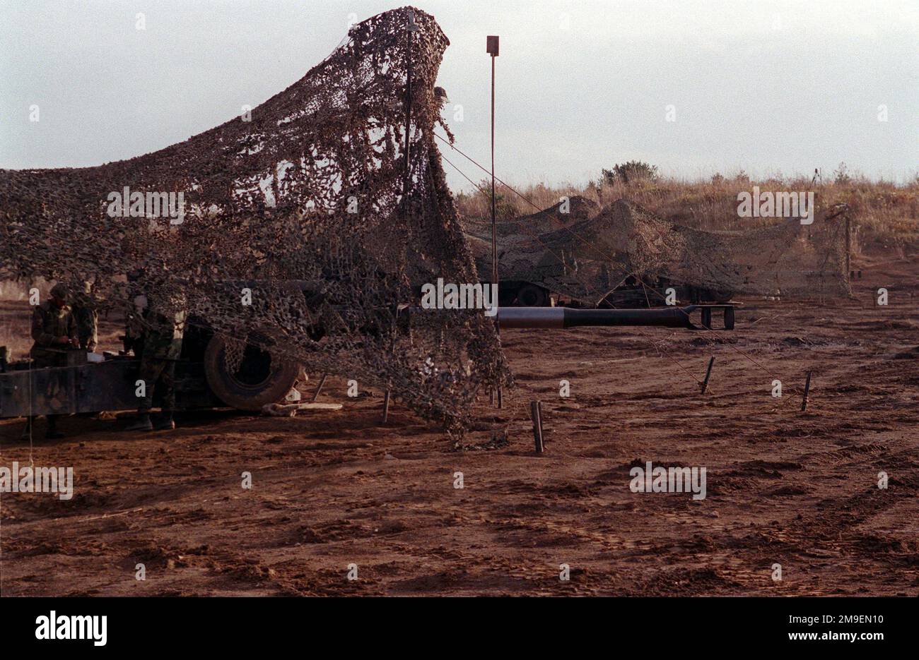 Right side profile medium shot of two US Marine M198 155mm Howitzers ...