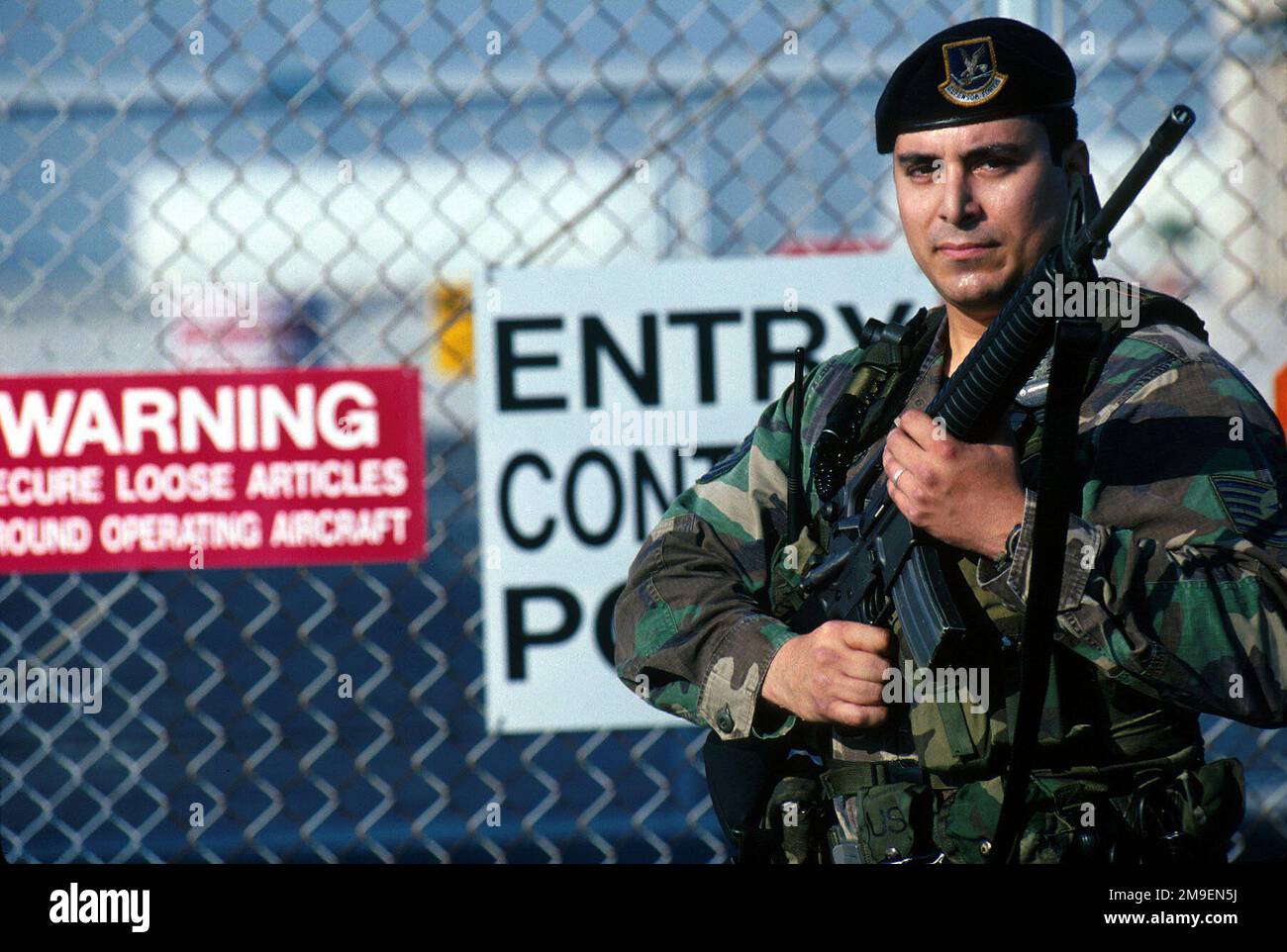 US Air Force Technical Sergeant Eddy Frank, armed with an M16 rifle ...