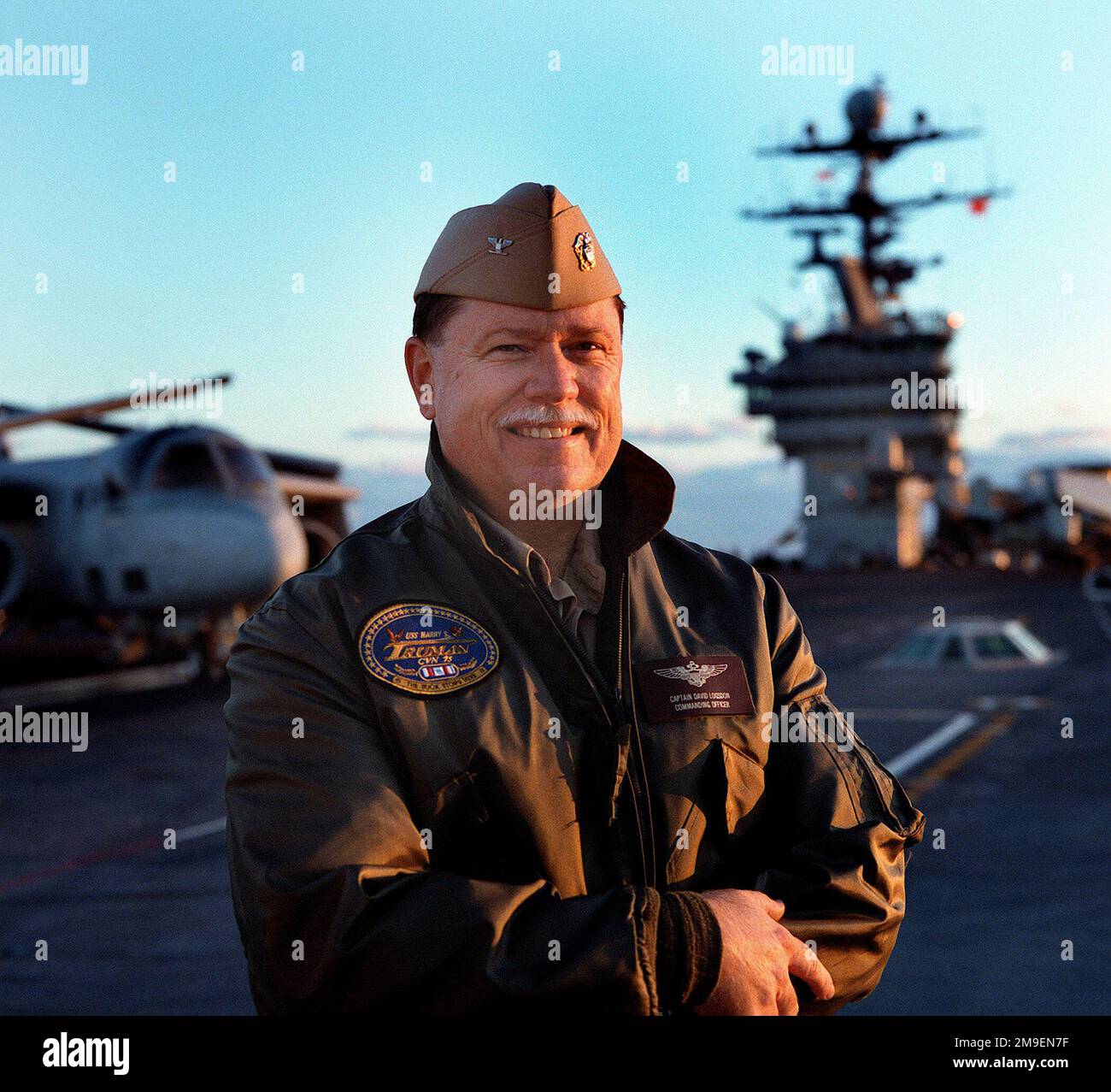 Shot of US Navy Captain David L. Logsdon, on the flight deck of the nuclear powered aircraft ...