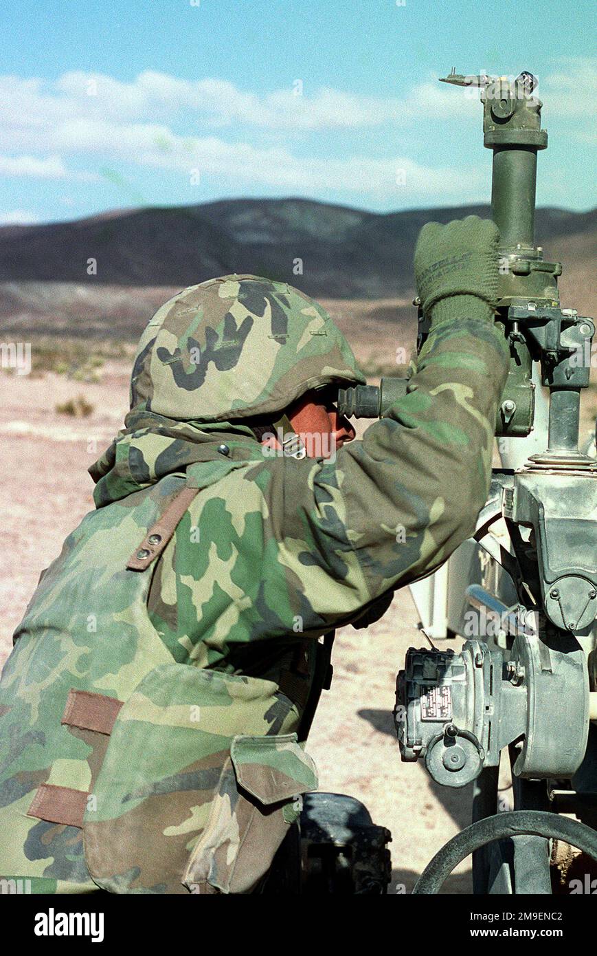 A Marine from 11th Marines Artillery, Kilo Battery, gun 3, does his ...
