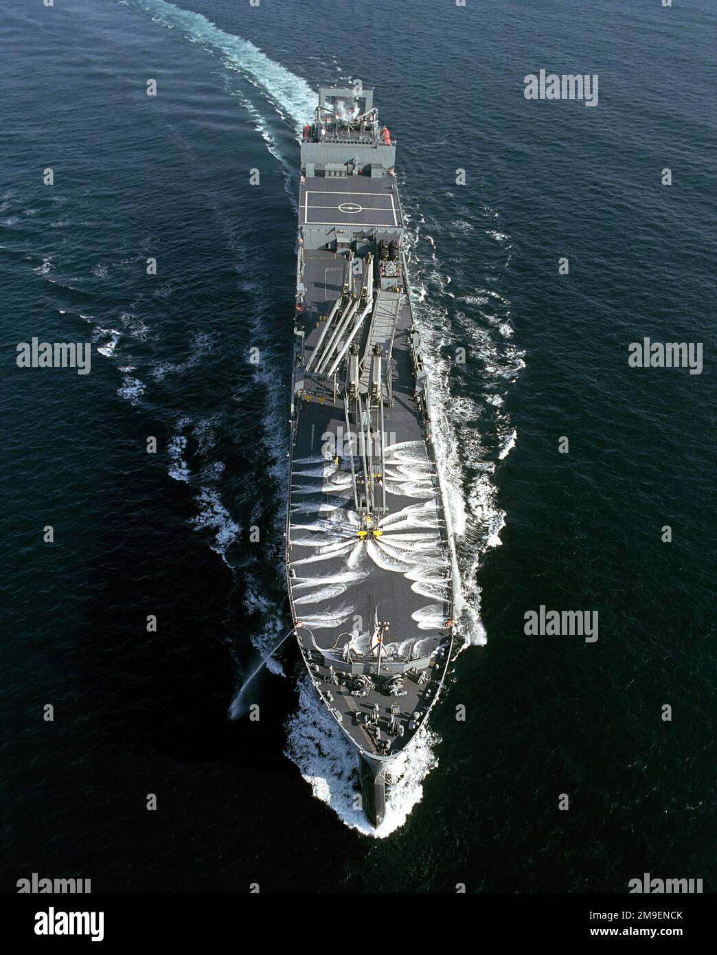A high oblique aerial view of the MSC (Military Sealift Command) strategic heavy lift ship USNS ...